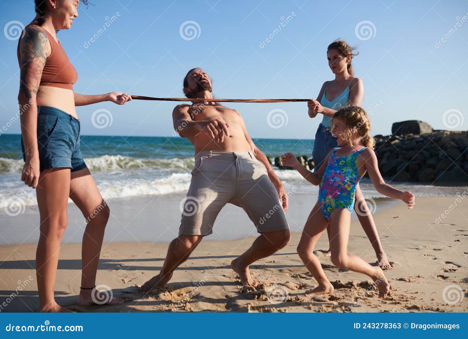 Family Playing Limbo stock image. Image of parent, travel - 243278363