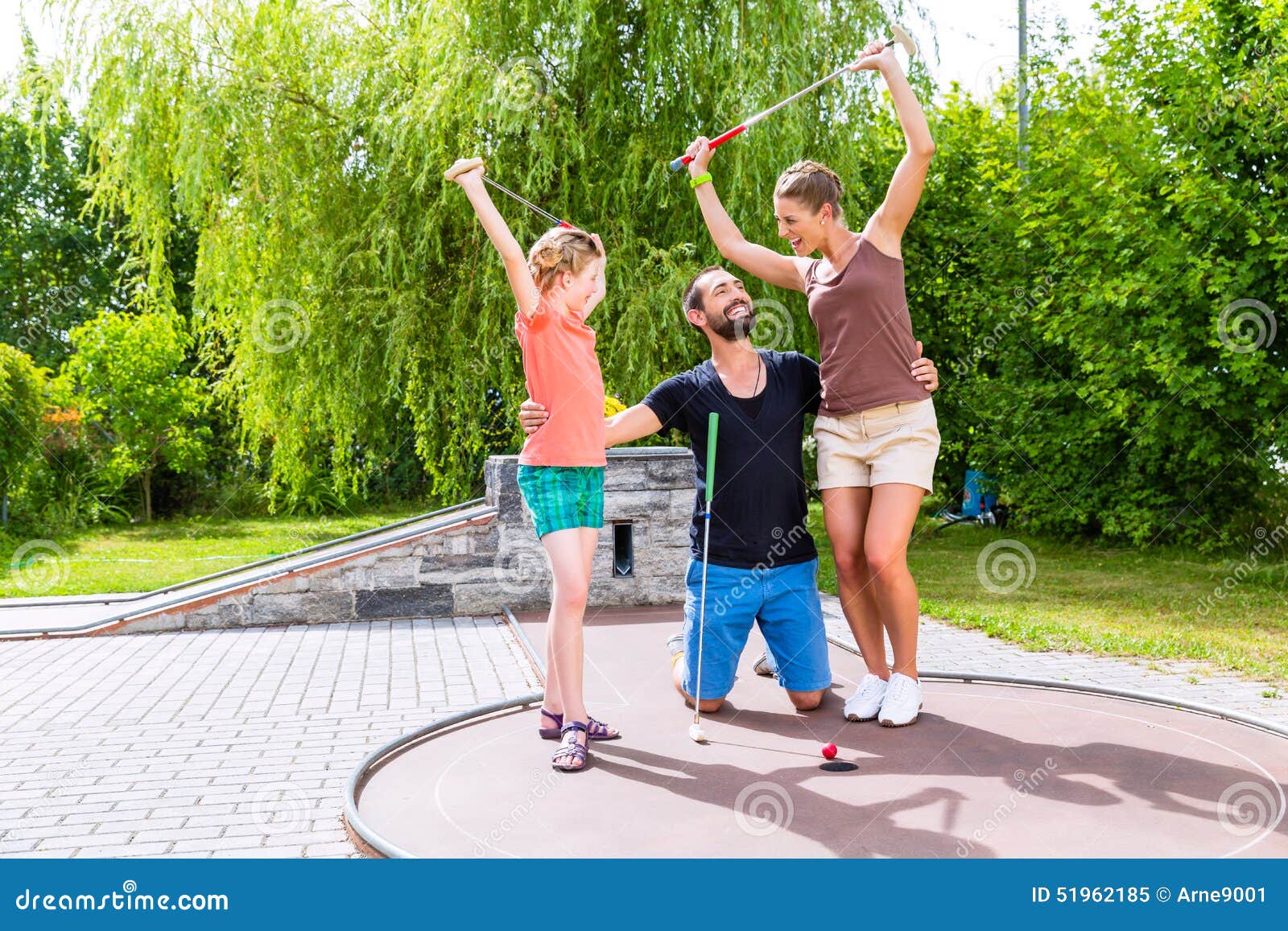 Family Playing Miniature Golf Stock Image - Image of caucasian ...