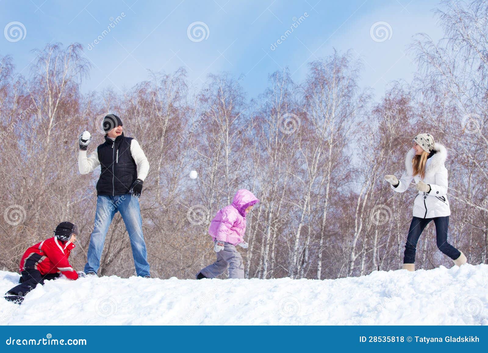 Family playing snowball stock photo. Image of thirties - 28535818