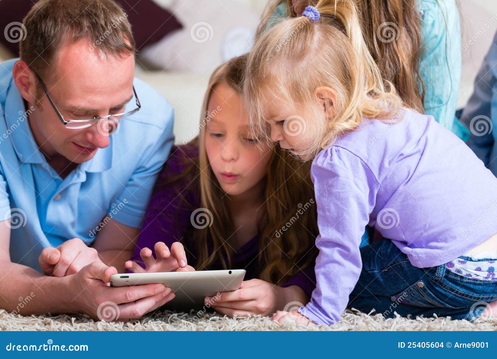 Family Playing with Tablet Computer at Home Stock Photo - Image of game ...