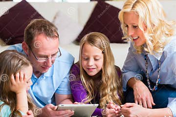 Family Playing with Tablet Computer at Home Stock Image - Image of ...