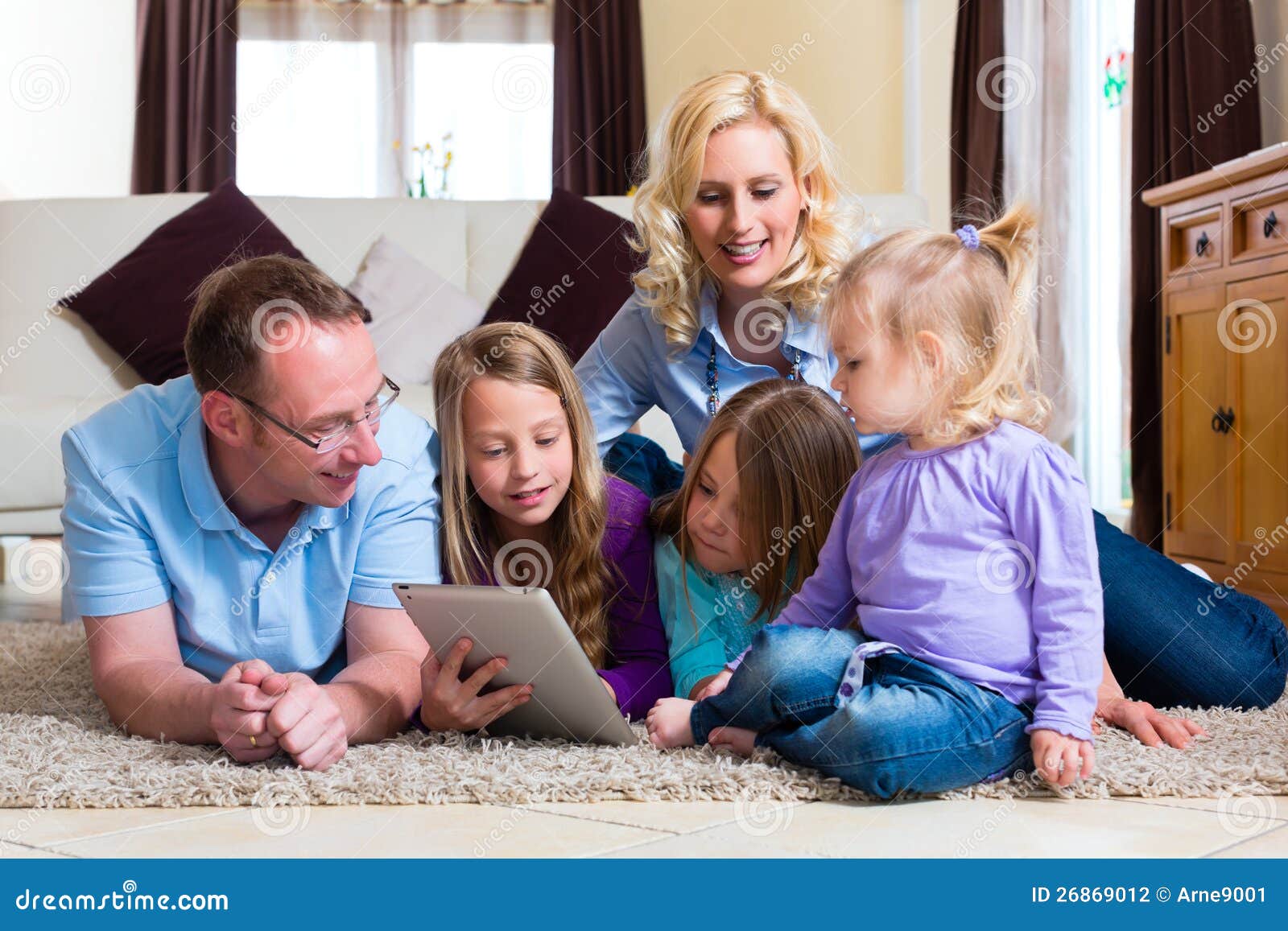 Family Playing with Tablet Computer at Home Stock Photo - Image of ...