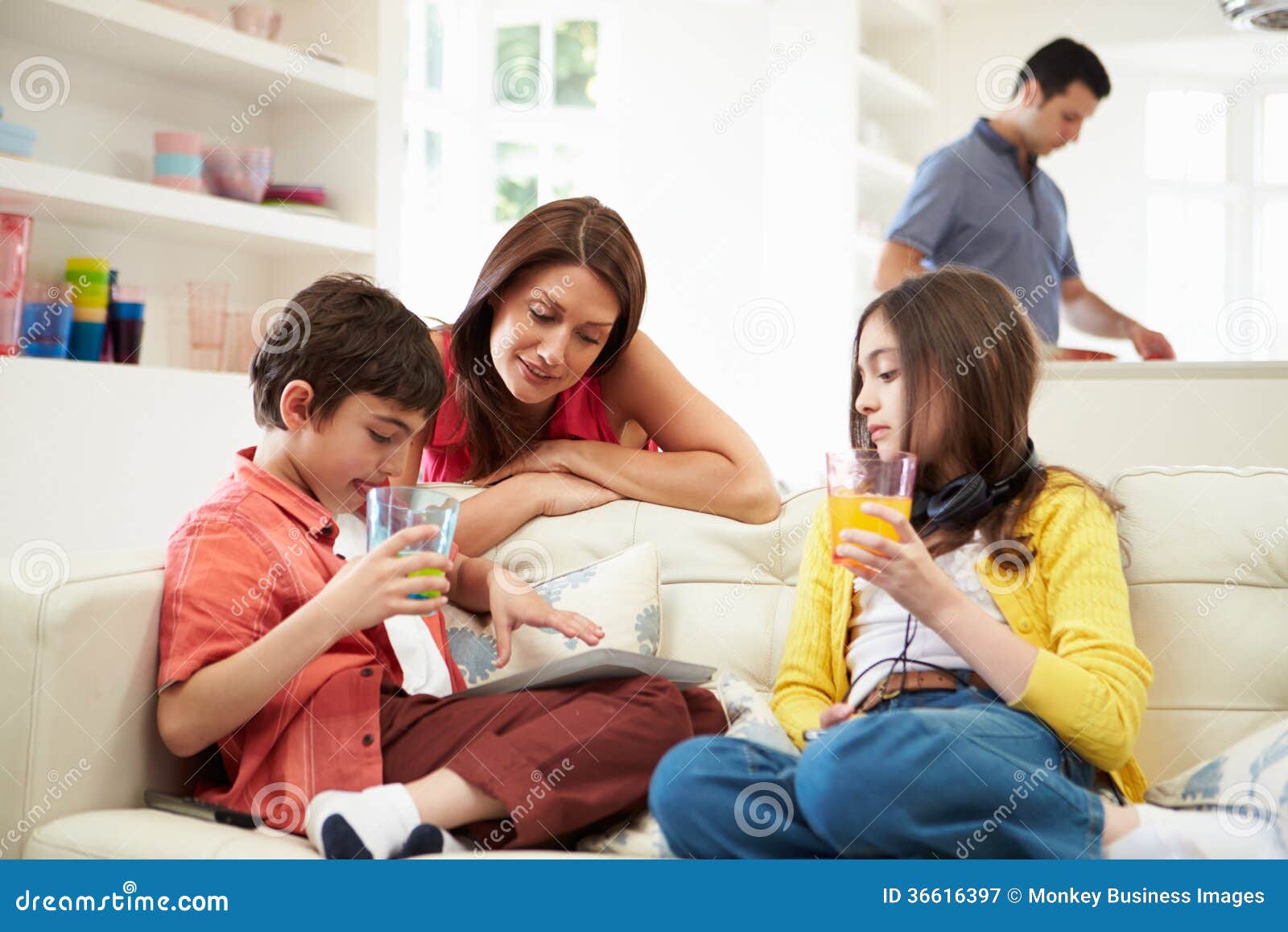 Family Playing with Tablet and MP3 Stock Image - Image of listening ...