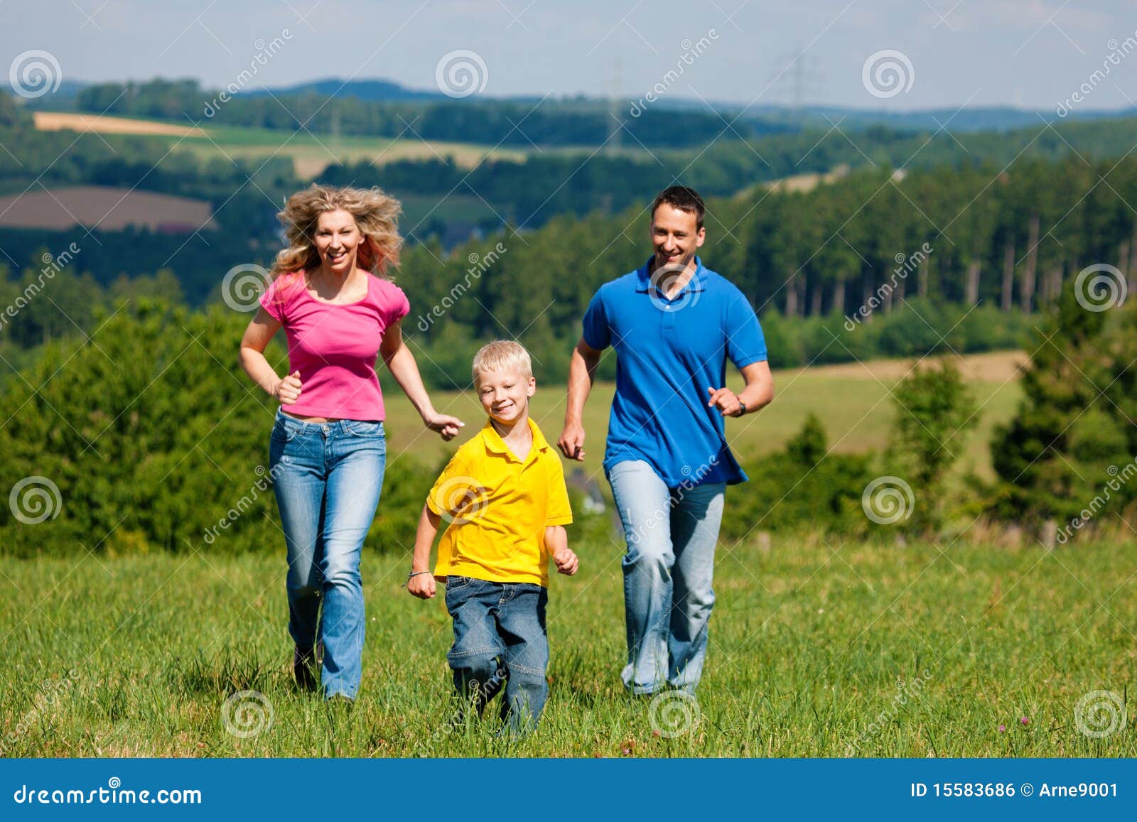 Family Playing Tag on Meadow in Summer Stock Photo - Image of running ...
