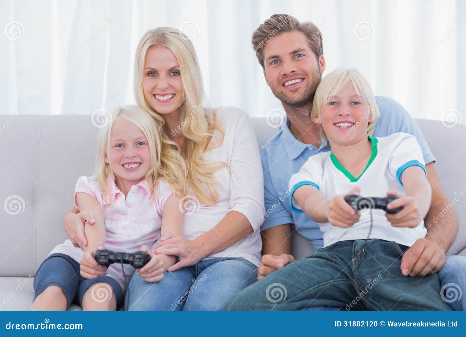 Family Playing Video Games at Home Stock Photo - Image of happy, homey ...