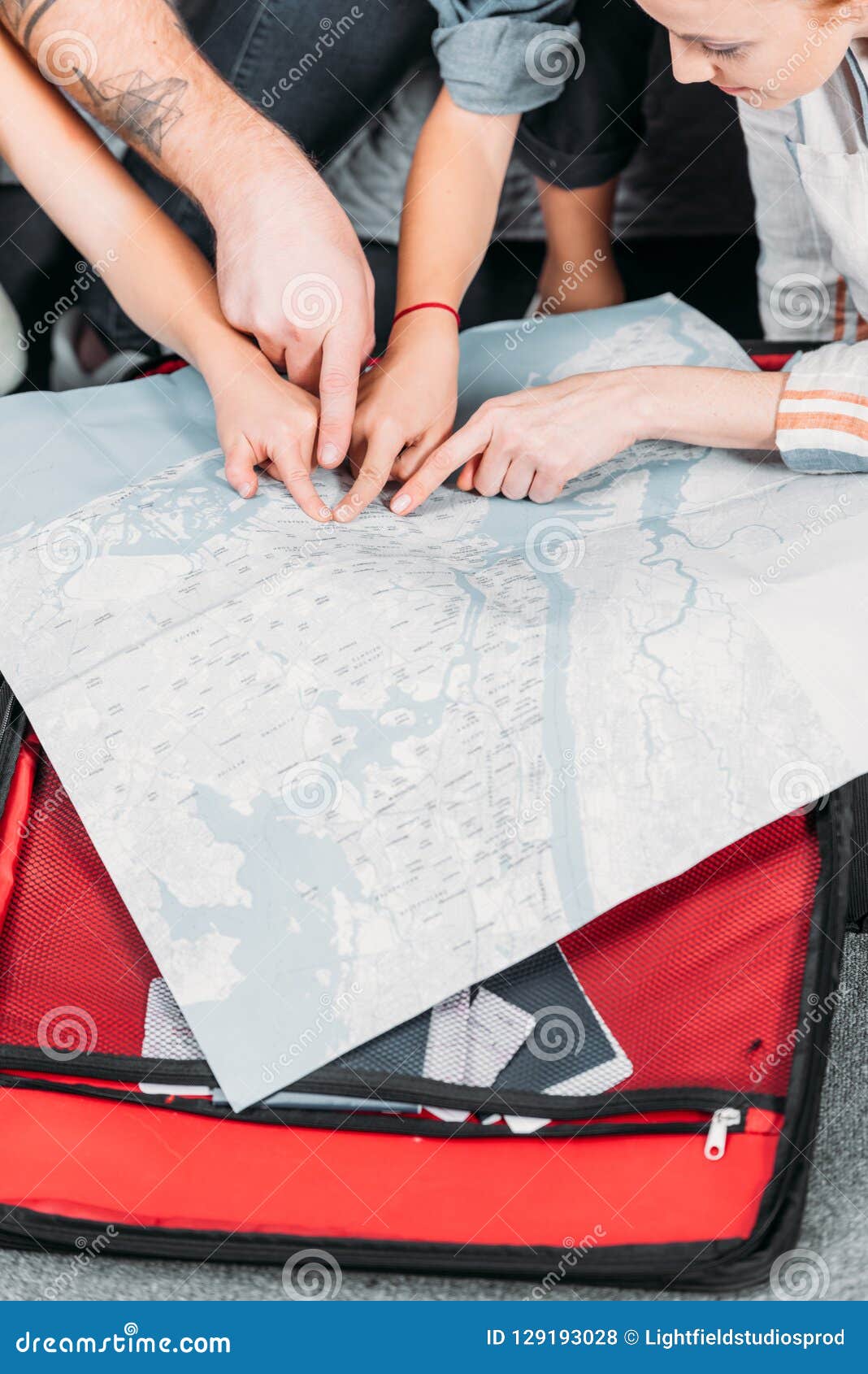 Cropped Shot of Family Pointing at Map while Stock Photo - Image of ...
