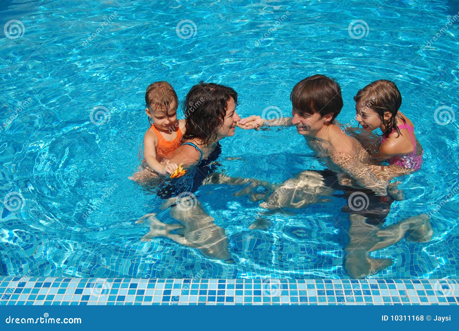 Family in the pool stock photo. Image of childhood, active - 10311168