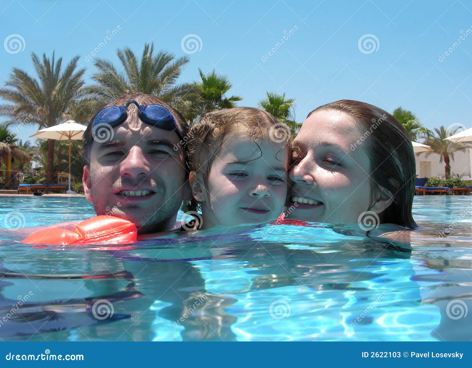 Family at the pool stock image. Image of cheerful, activities - 2622103