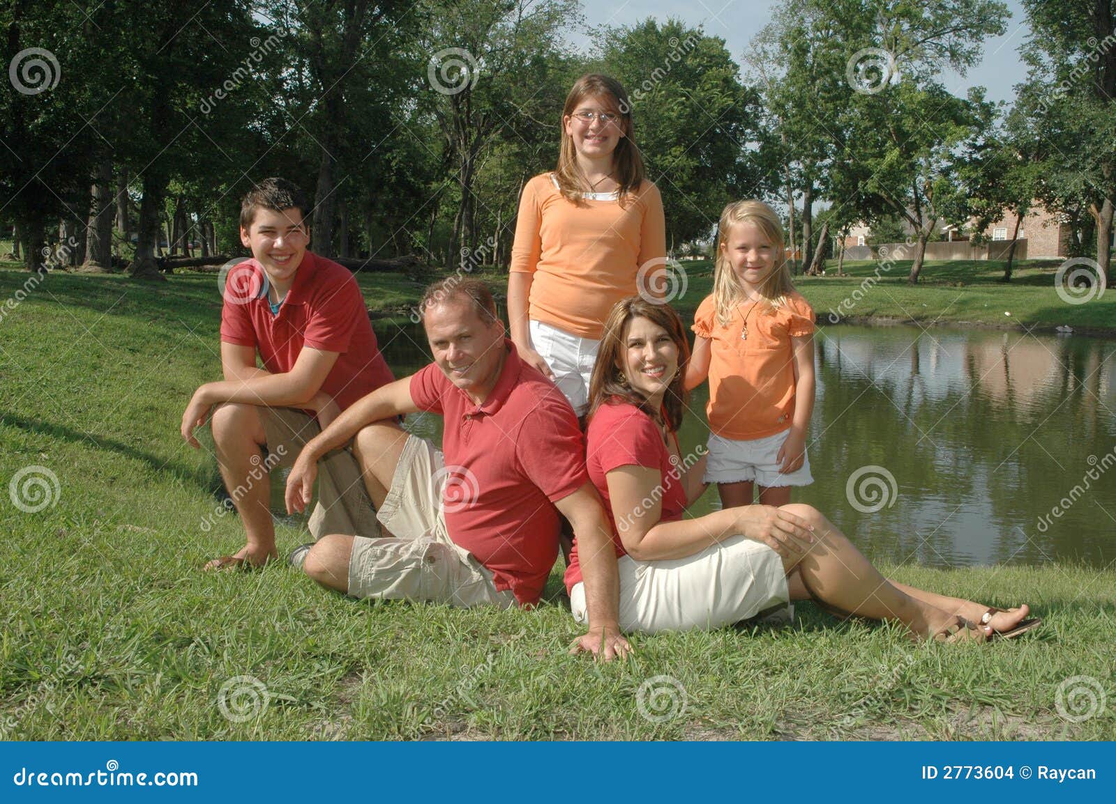Family posing by pond stock photo. Image of five, outdoors - 2773604