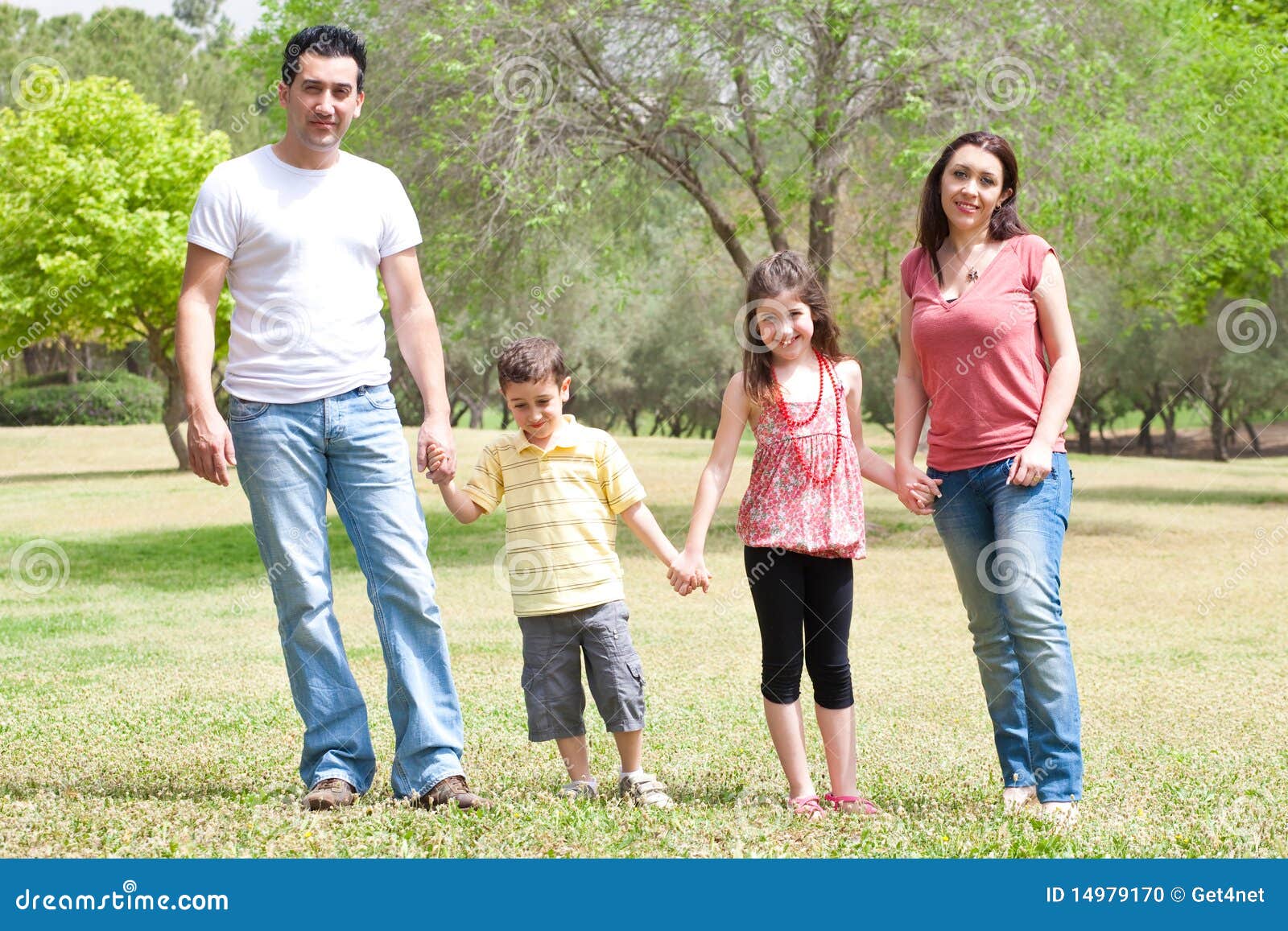 Family Posing To Camera in the Park Stock Photo - Image of happy ...