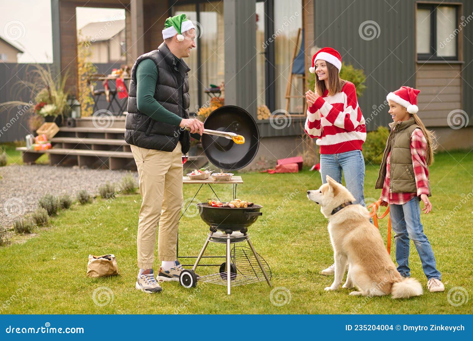 A Family Preparing Christmas Dinner and Looking Involved Stock Photo ...