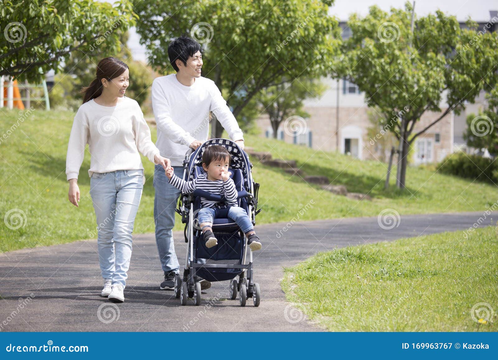 Family Pulled a Stroller To Walk in the Park Stock Image - Image of ...