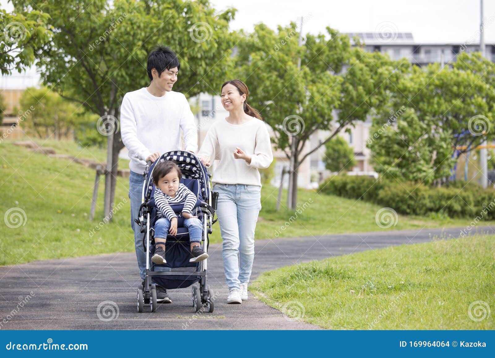 Family Pulled a Stroller To Walk in the Park Stock Photo - Image of ...