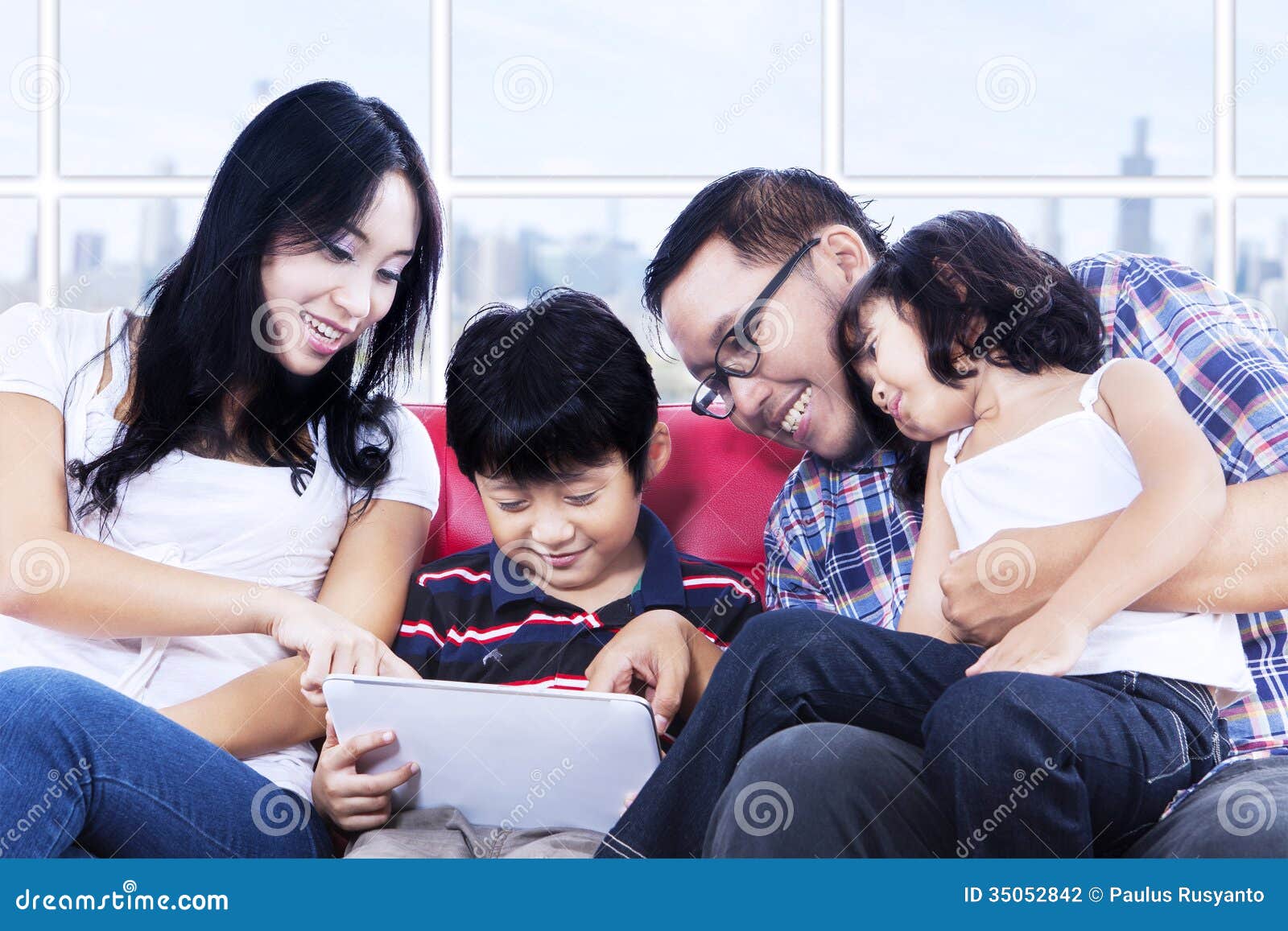 Family Quality Time Using Touchpad at Apartment Stock Photo - Image of ...