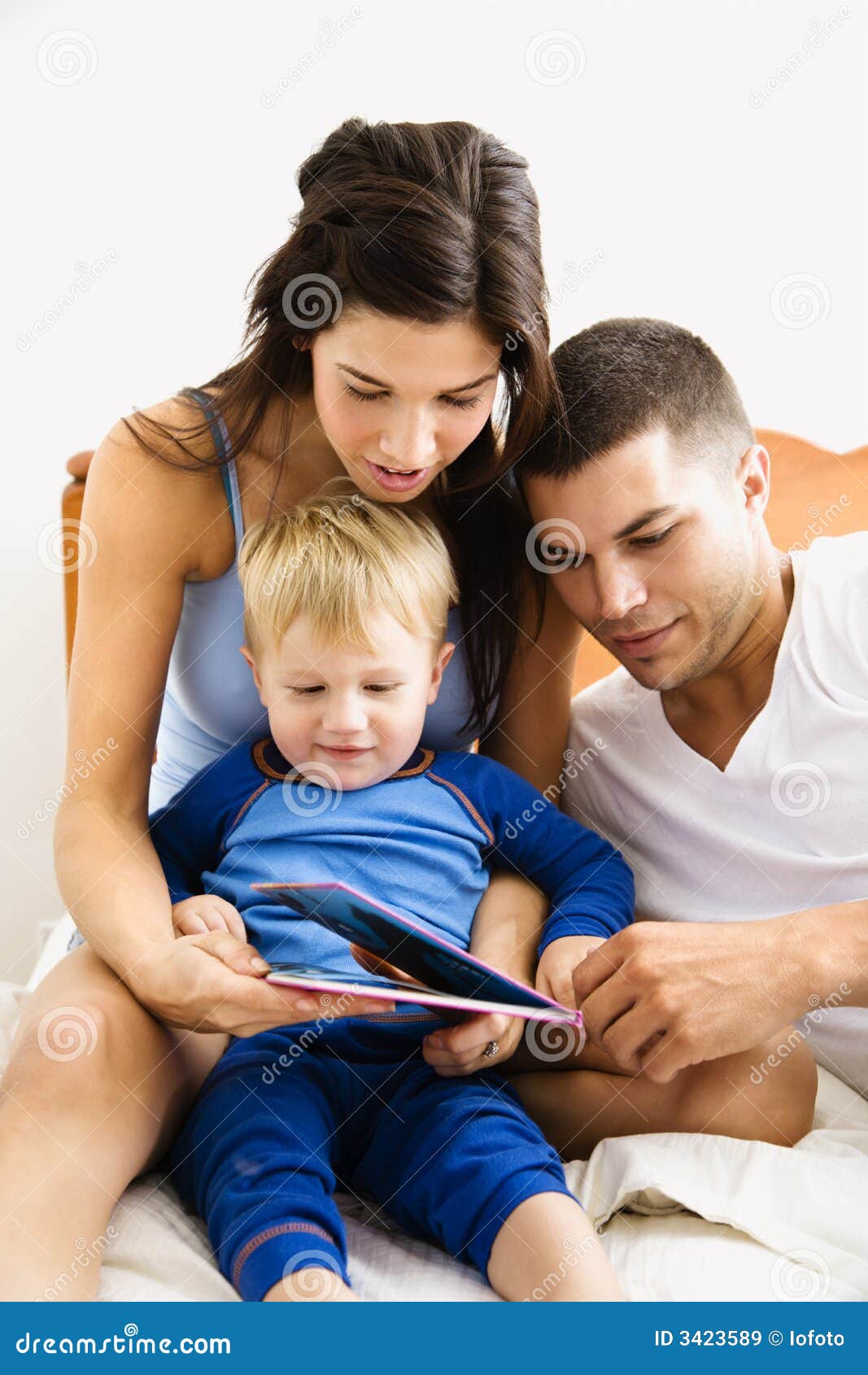 Family reading. stock image. Image of brunette, female - 3423589