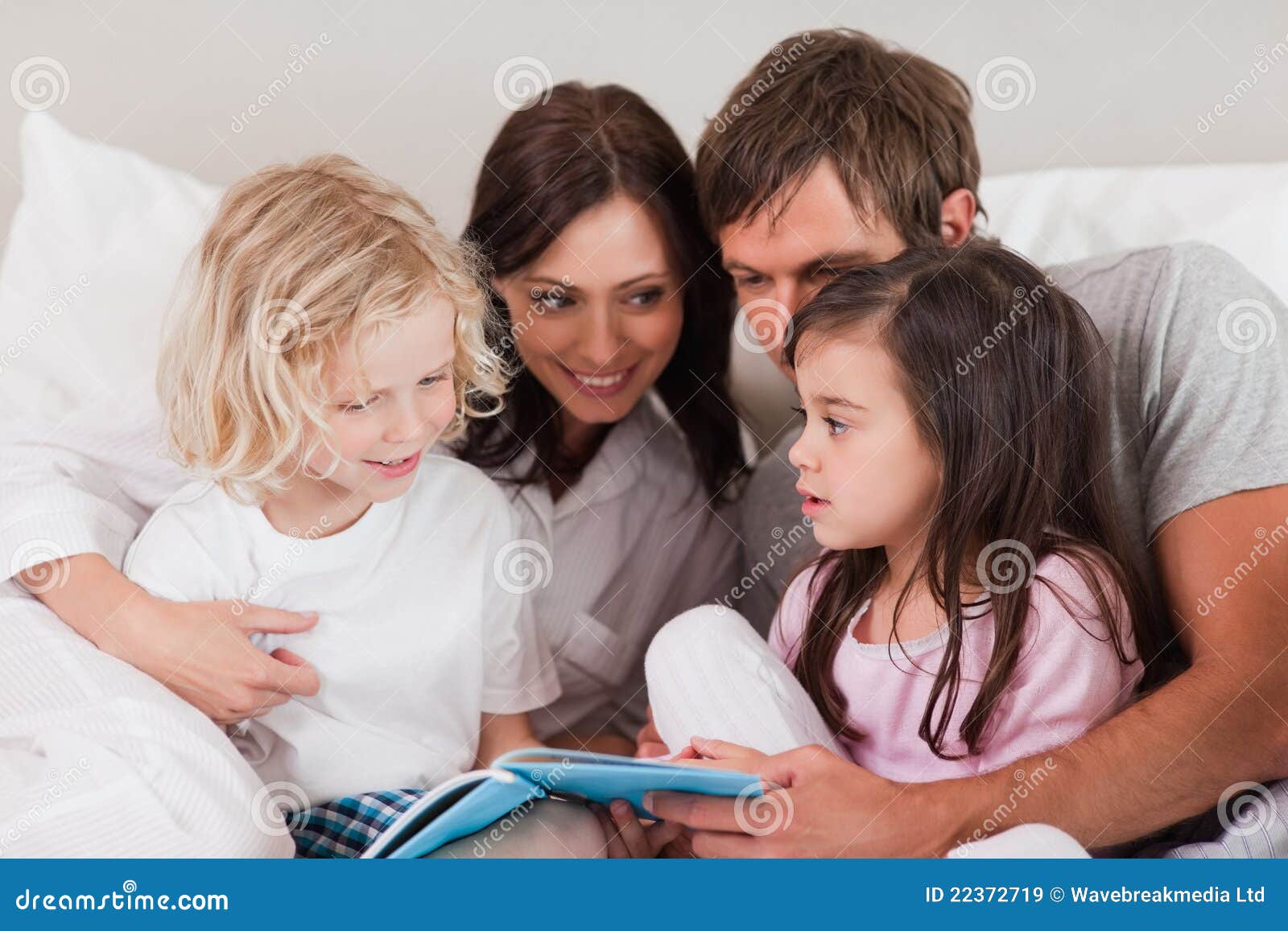 Family reading a book stock image. Image of casual, education - 22372719