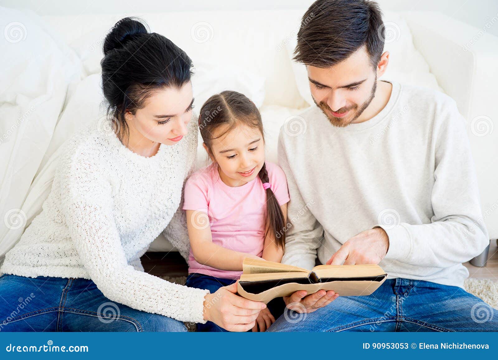 Family reading a book stock image. Image of bonding, indoors - 90953053