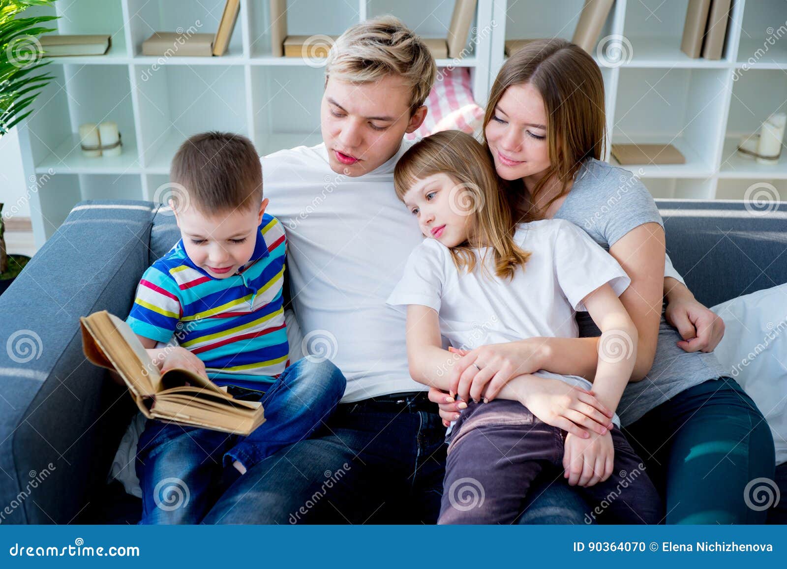 Family reading book stock photo. Image of female, popcorn - 90364070