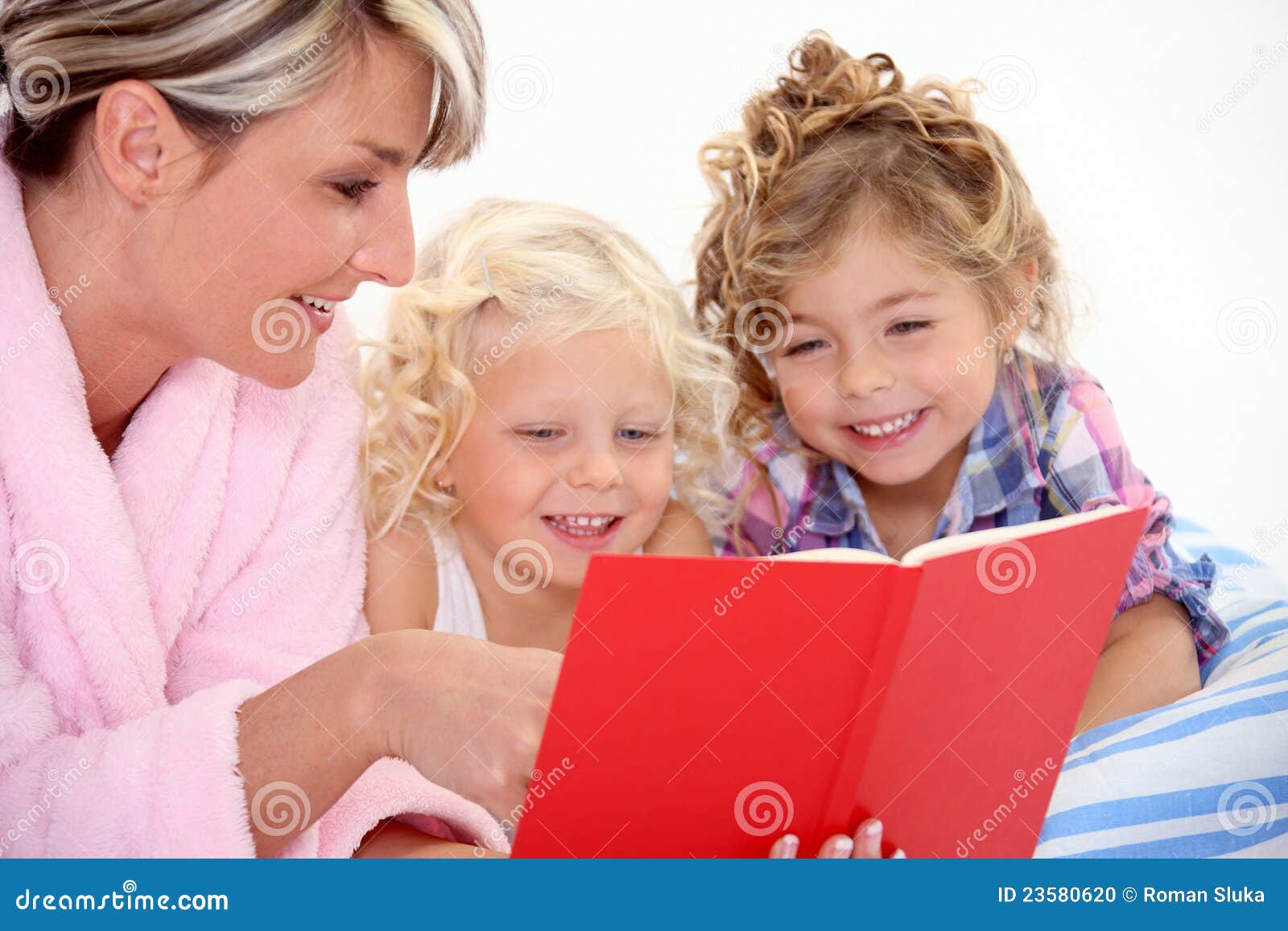 Family Reading a Book Together Stock Photo - Image of time, women: 23580620