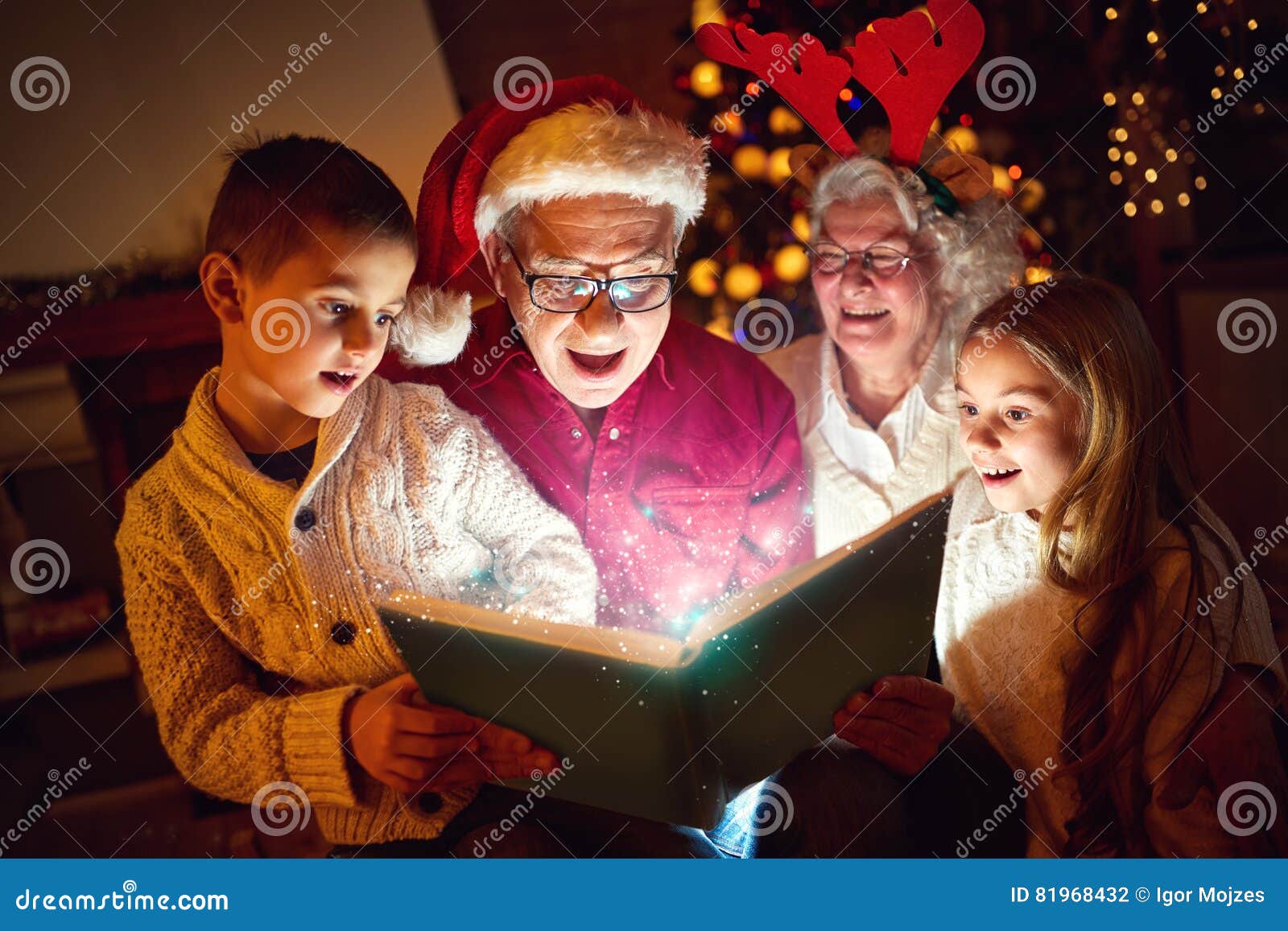 Family Reading Christmas Magic Book Stock Photo - Image of happy ...