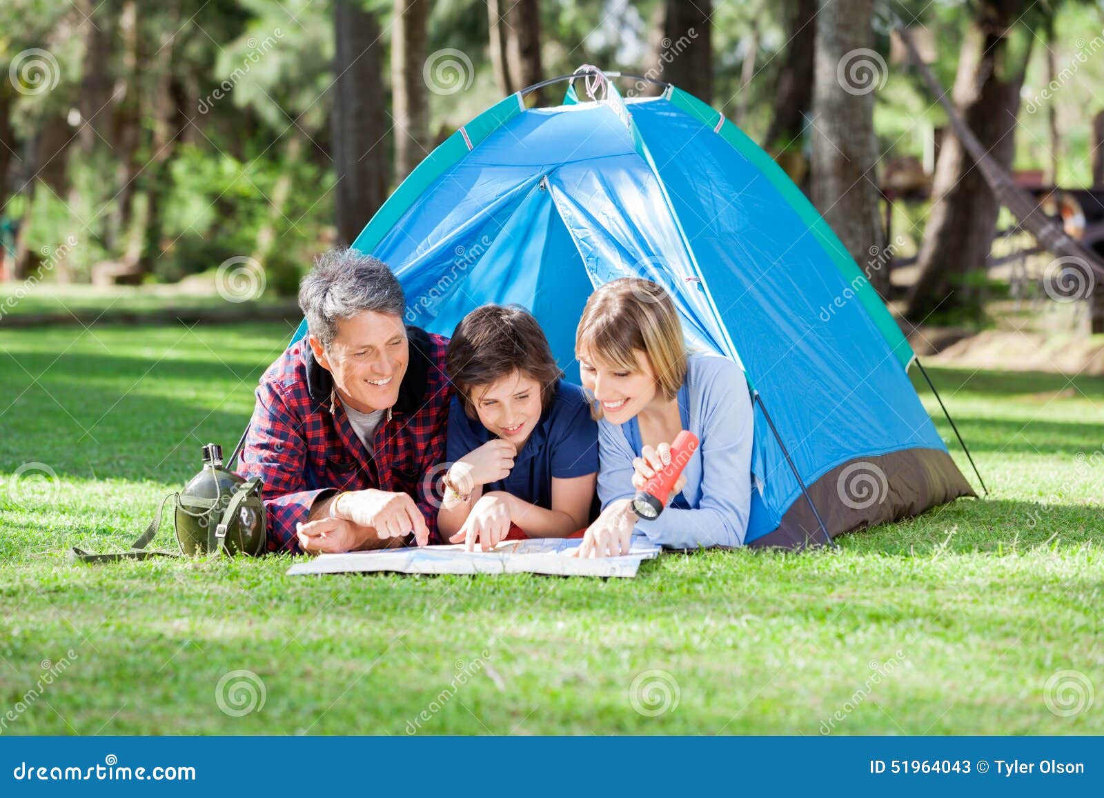 Family Reading Map at Campsite Stock Image - Image of grass, love: 51964043