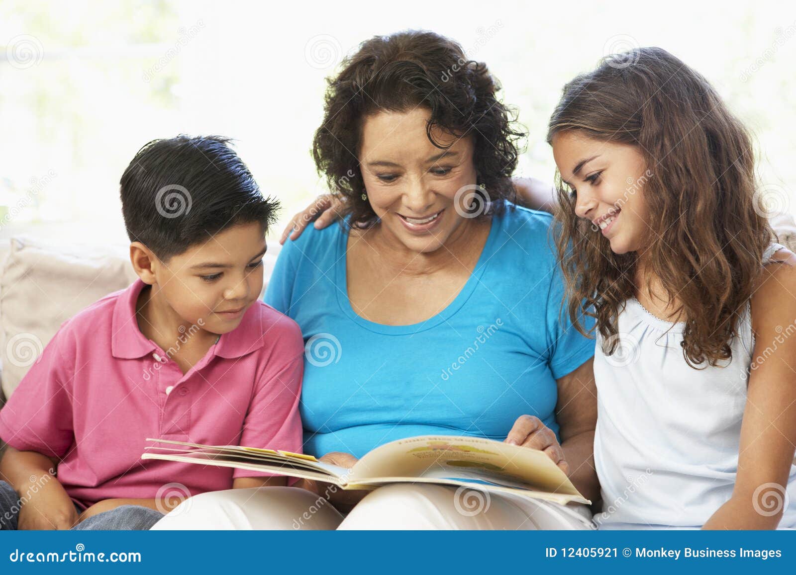 Family Relaxing at Home Reading a Book Stock Image - Image of ...
