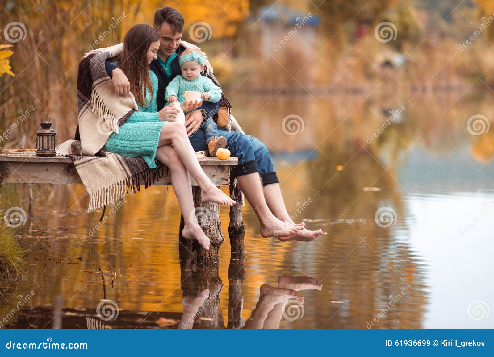 Family resting on the lake stock image. Image of holiday - 61936699