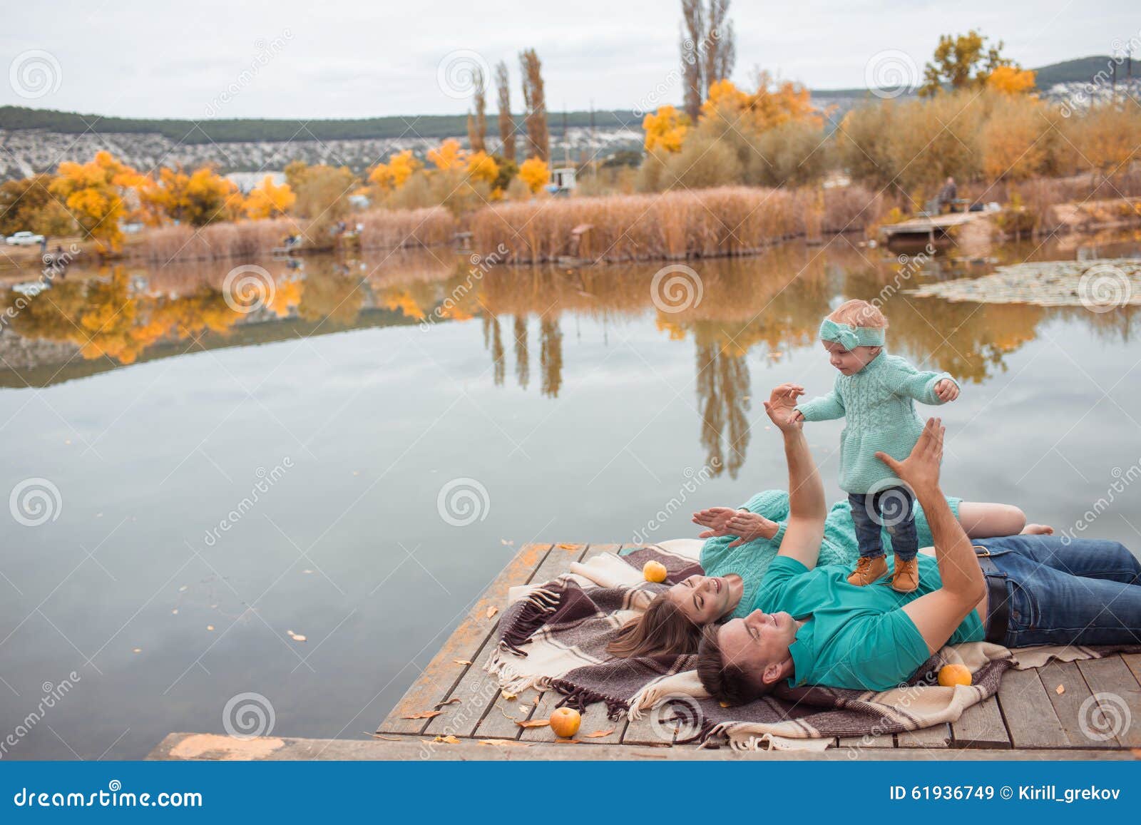 Family resting on the lake stock image. Image of lake - 61936749