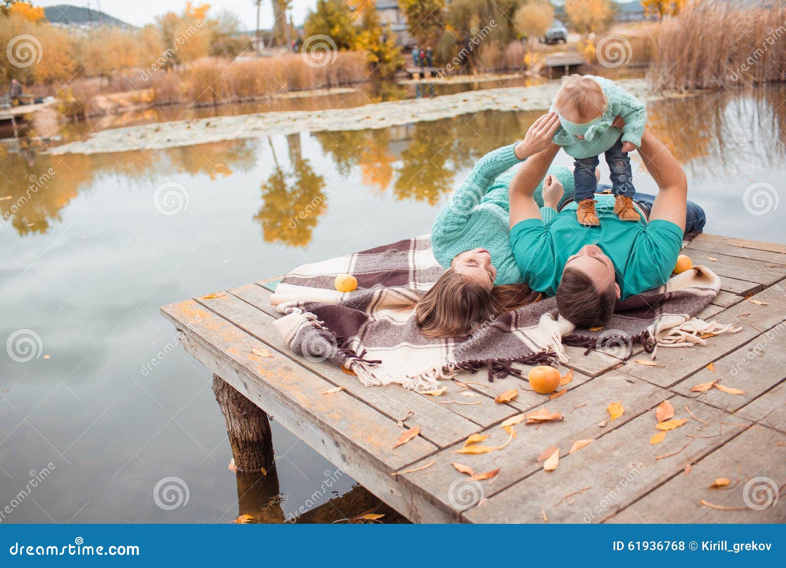 Family resting on the lake stock photo. Image of lake - 61936768