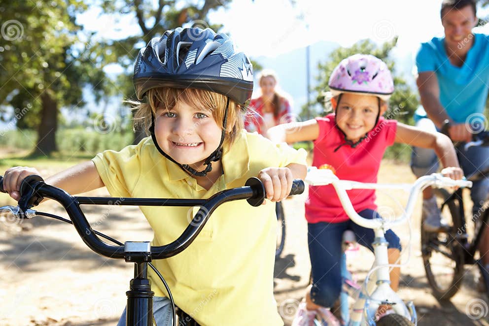 Family Riding Bikes Having Fun Stock Image - Image of bike, foreground ...