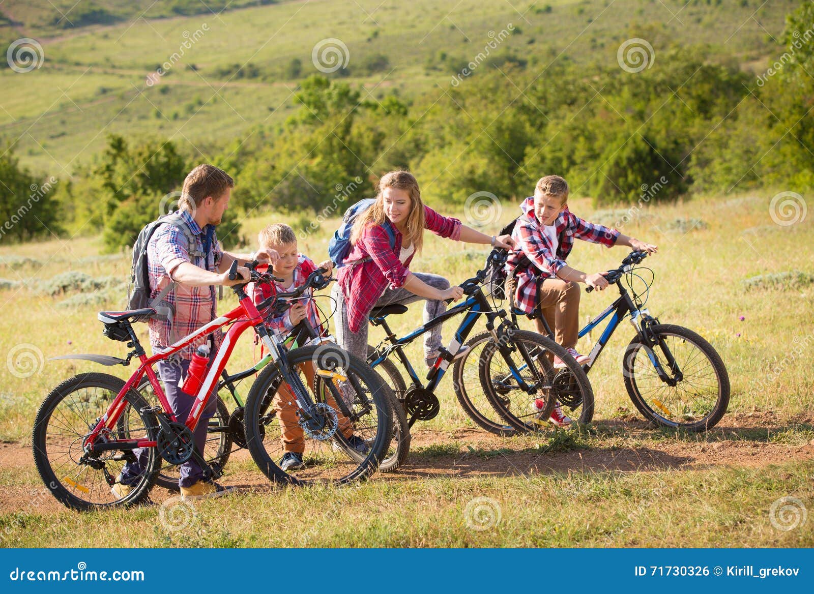 Family Riding Bikes in the Mountains Stock Photo - Image of holidays ...