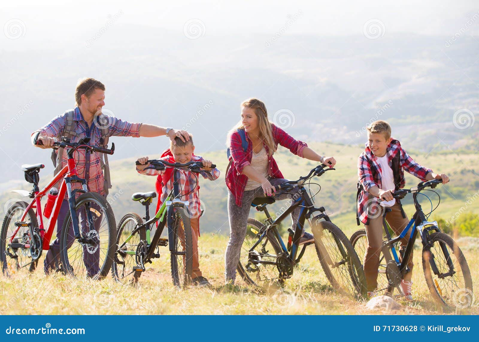 Family Riding Bikes in the Mountains Stock Photo - Image of girl ...