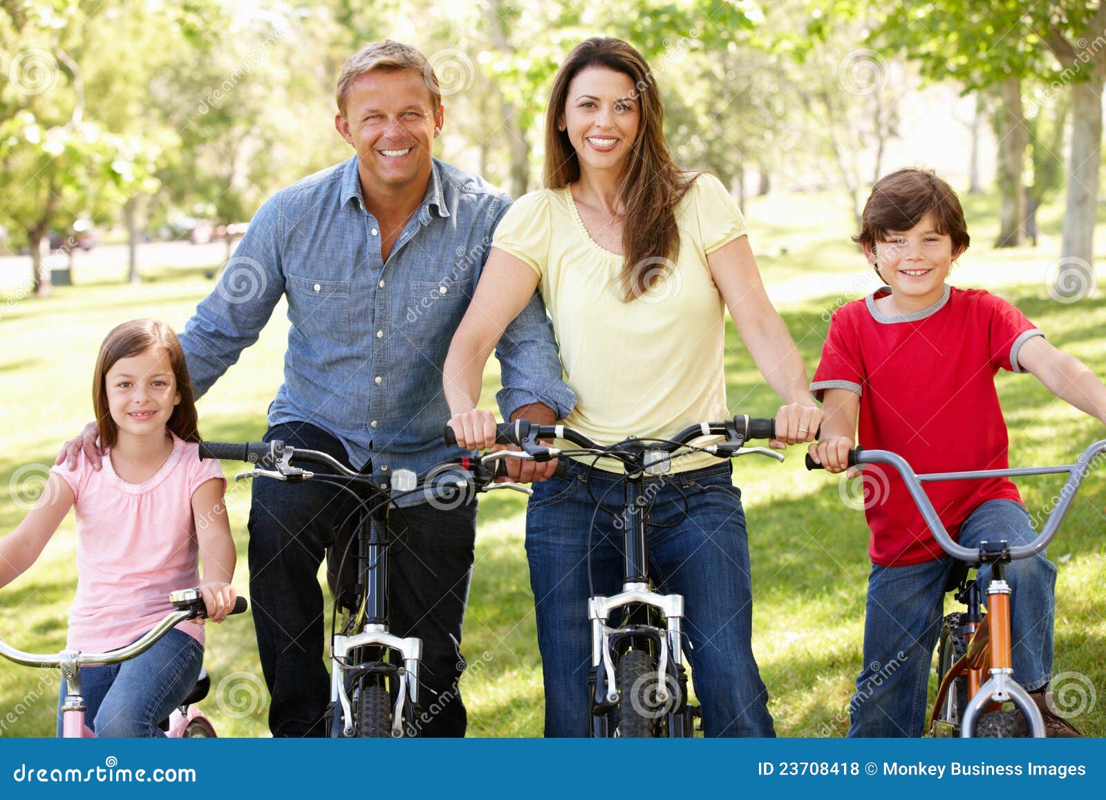 Family Riding Bikes in Park Stock Photo - Image of happy, father: 23708418
