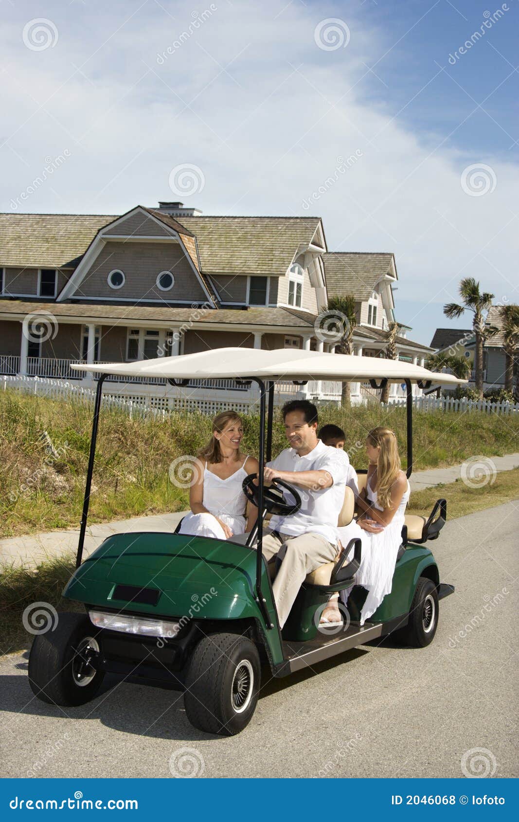 Family Riding in Golf Cart. Stock Photo - Image of outdoors, female ...