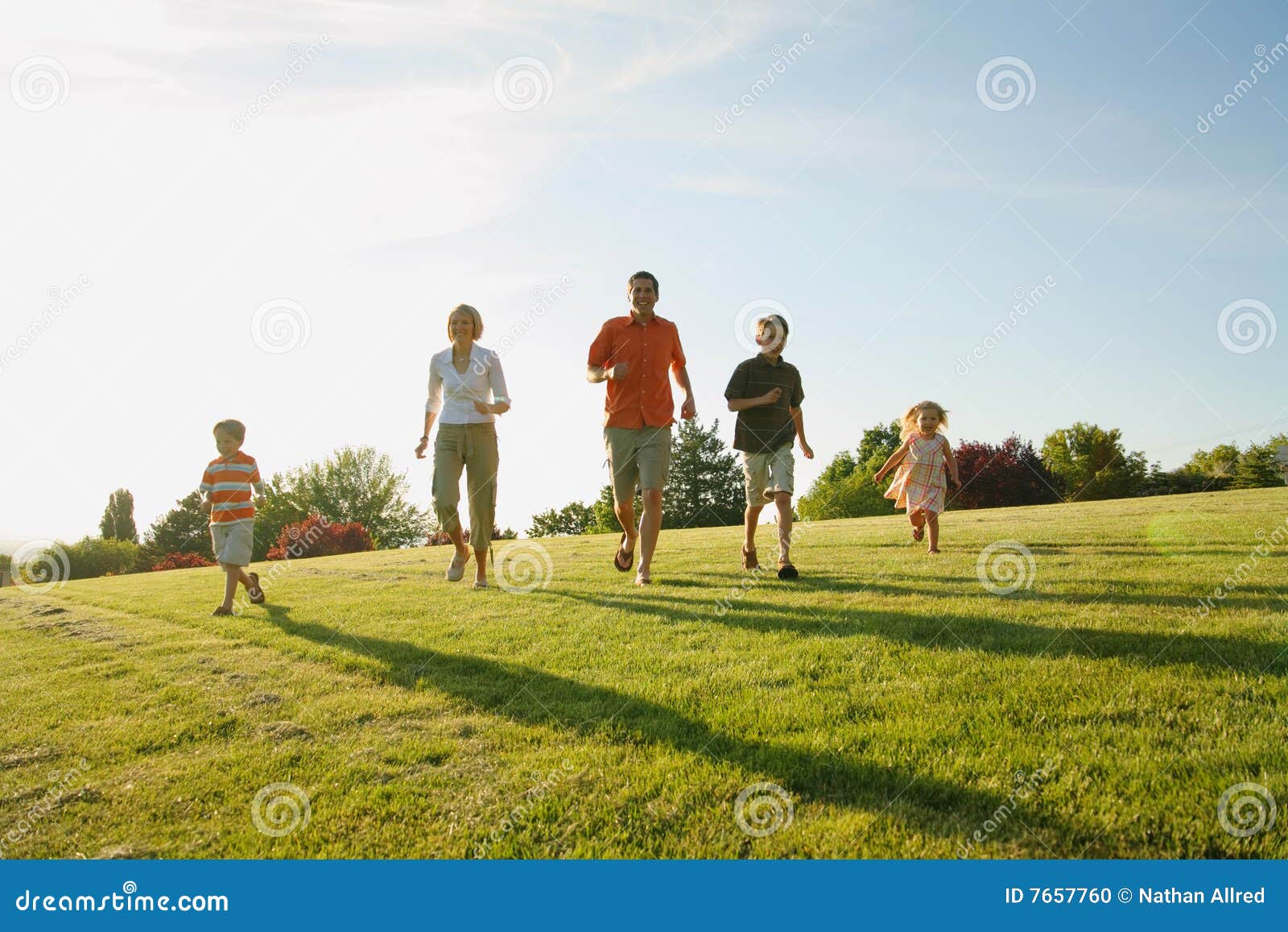 Family Running stock photo. Image of grass, happy, orange - 7657760