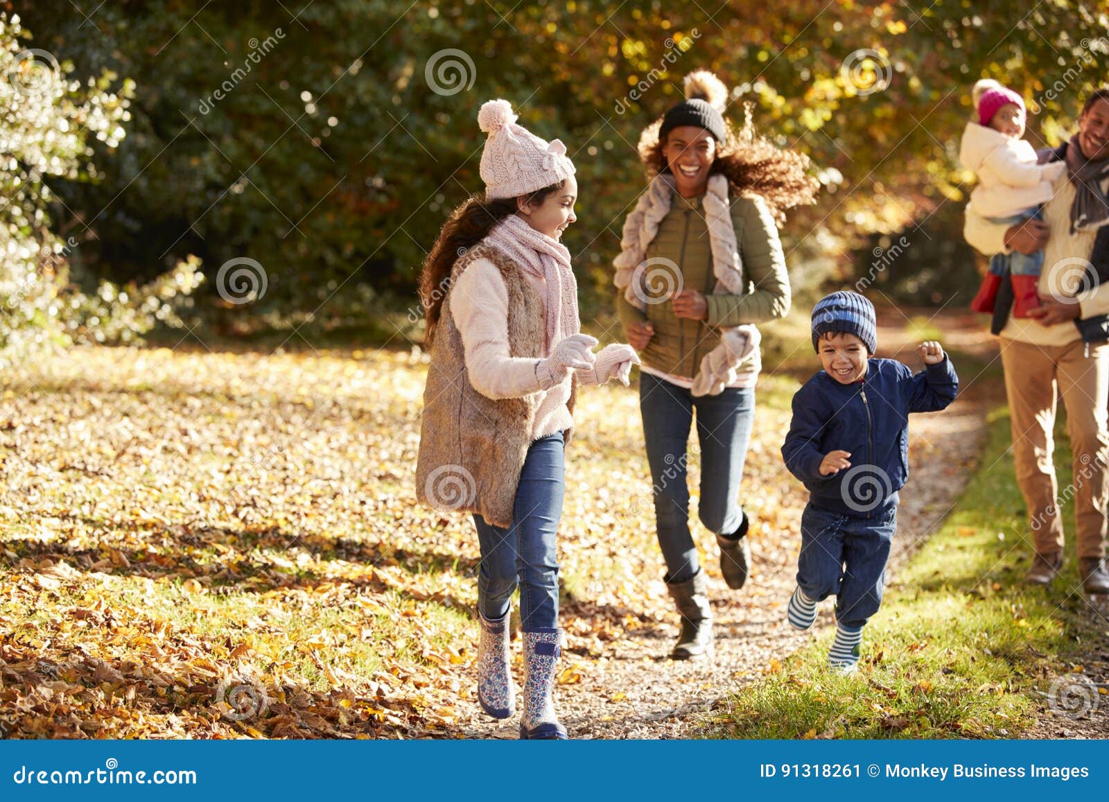 Family Running Along Path through Autumn Countryside Stock Image ...