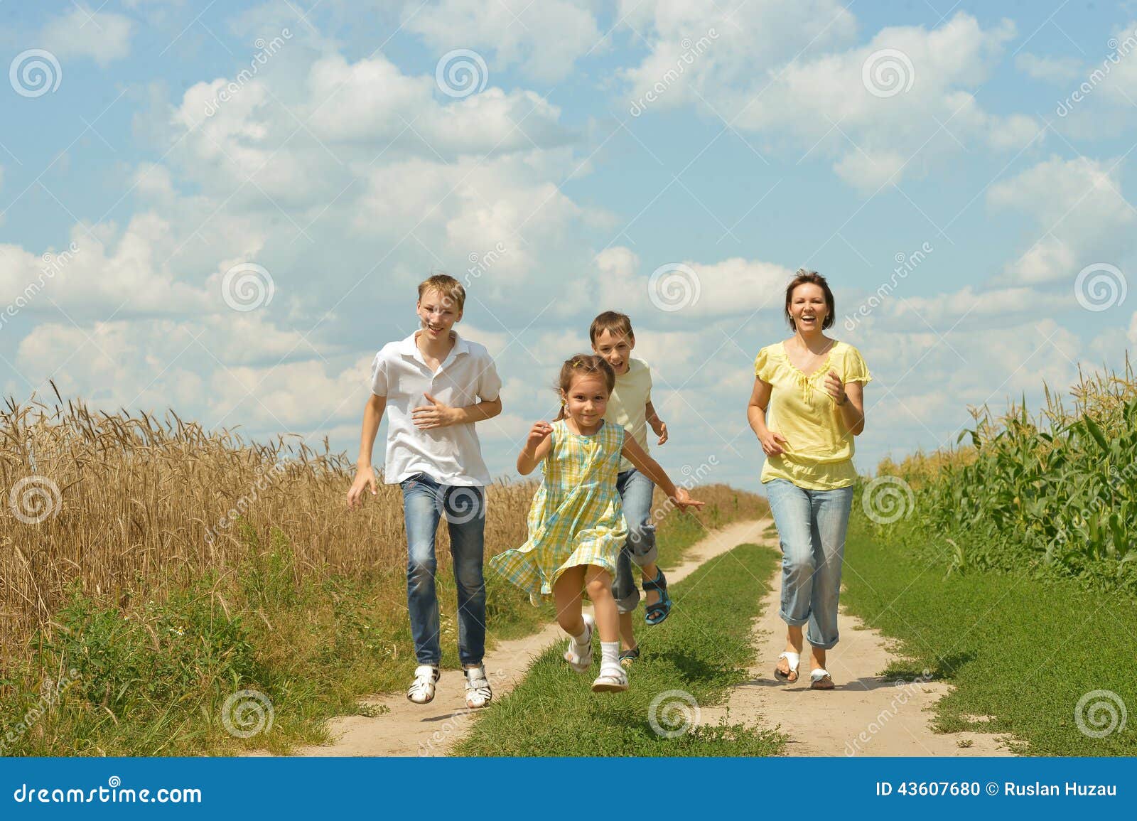 Family Running on a Dirt Road Stock Photo - Image of group, grass: 43607680