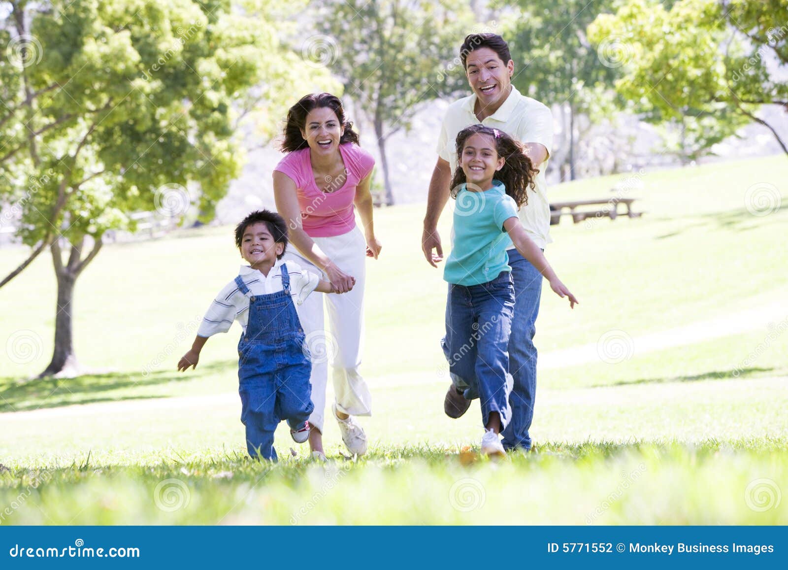 Family Running Outdoors Holding Hands and Smiling Stock Photo - Image ...