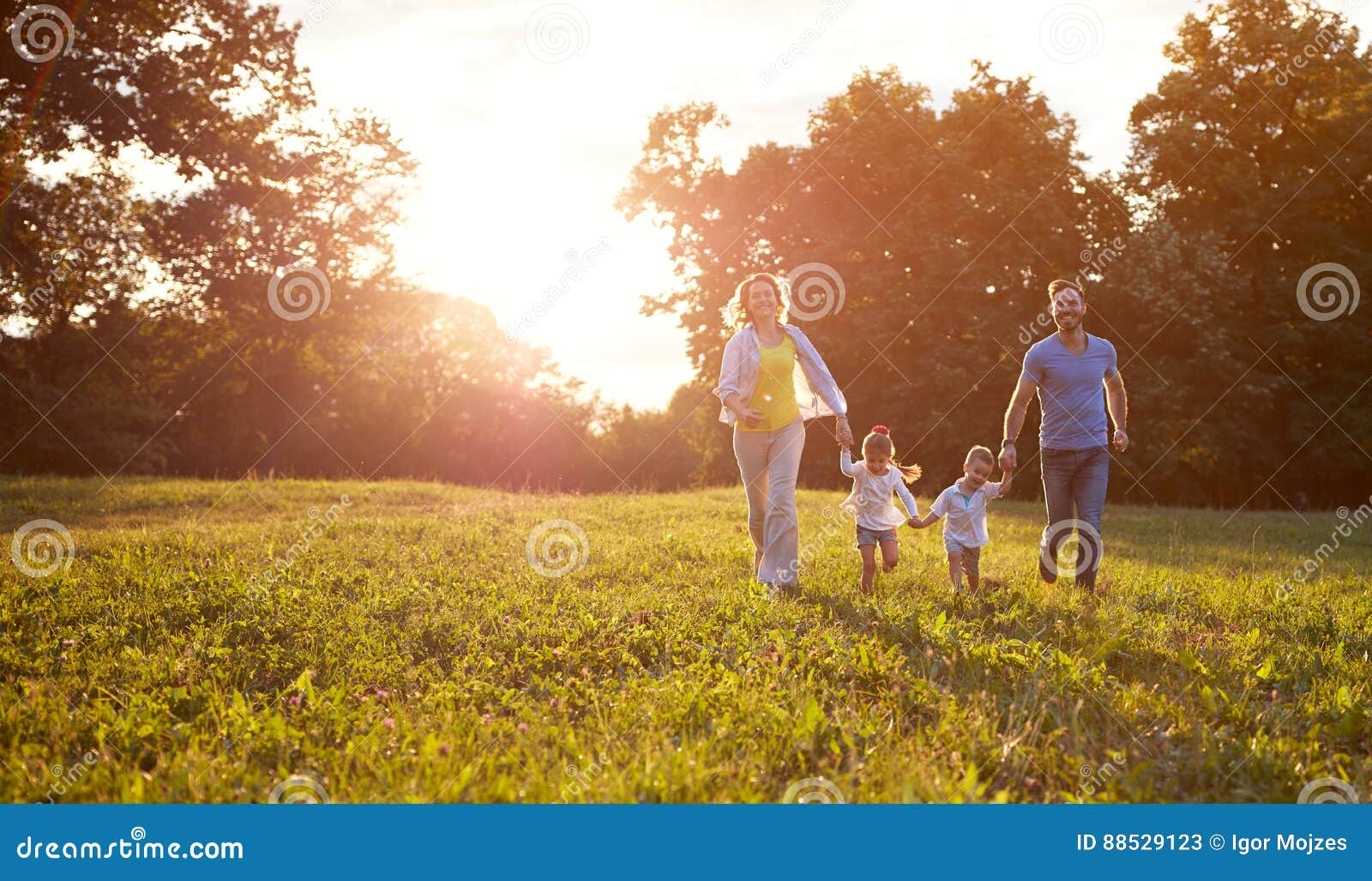 Family running in park stock image. Image of grass, beautiful - 88529123