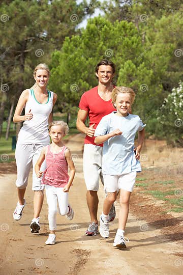 Family Running on Path in Park Stock Image - Image of camera, fitness ...