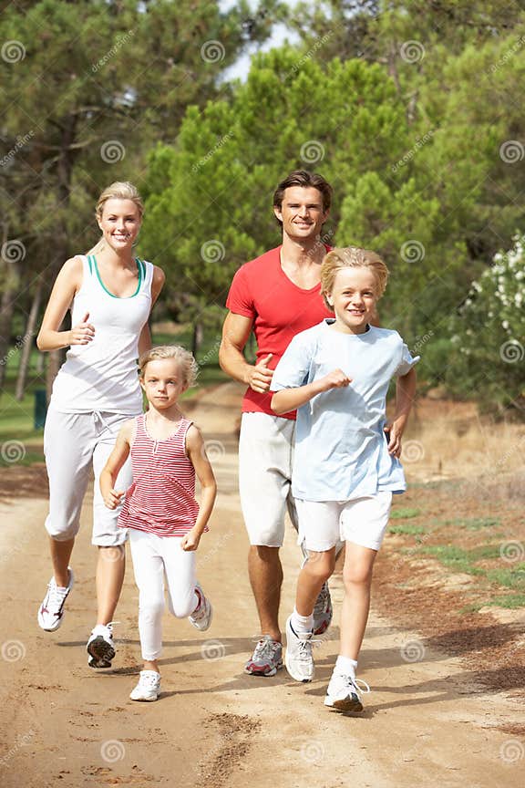 Family Running on Path in Park Stock Image - Image of camera, fitness ...