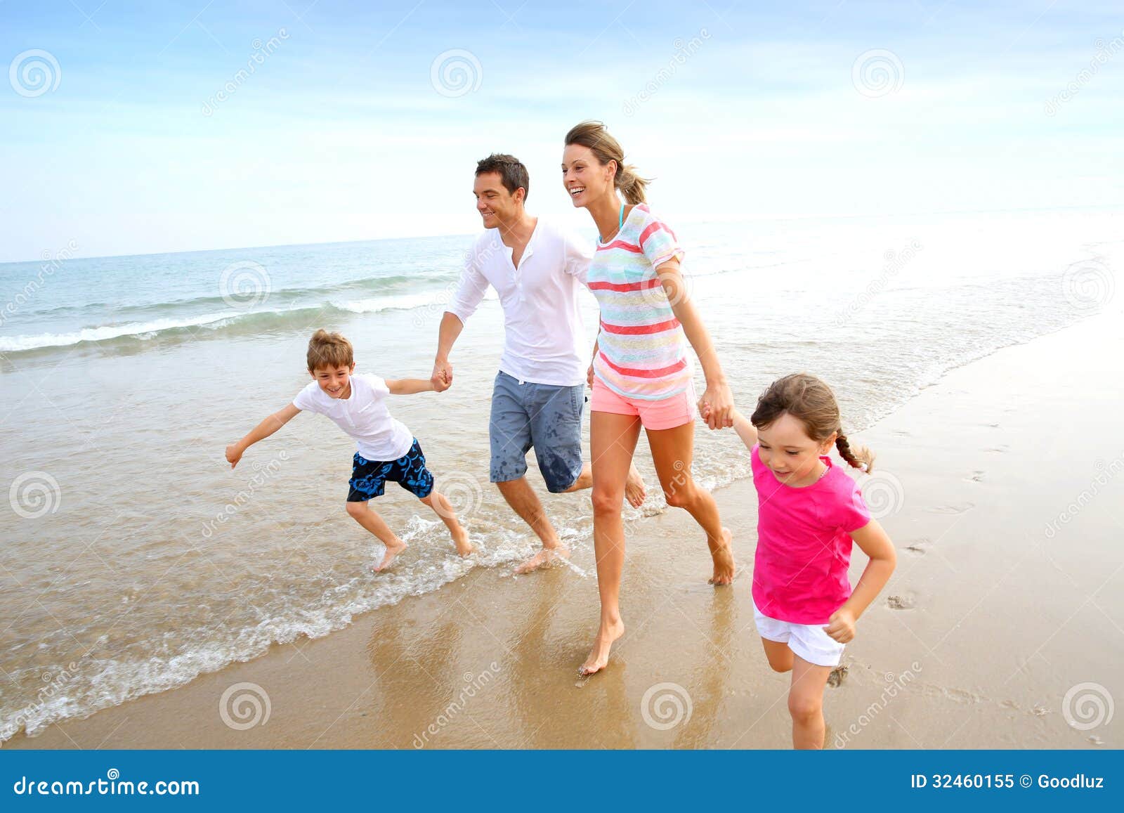 Family Running on a Sandy Beach Stock Image - Image of summer, people ...