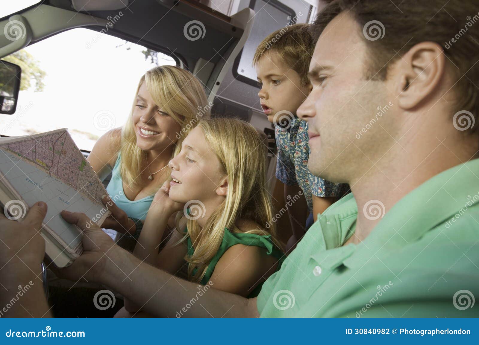 Family in RV Looking at Road Map Stock Photo - Image of recreational ...