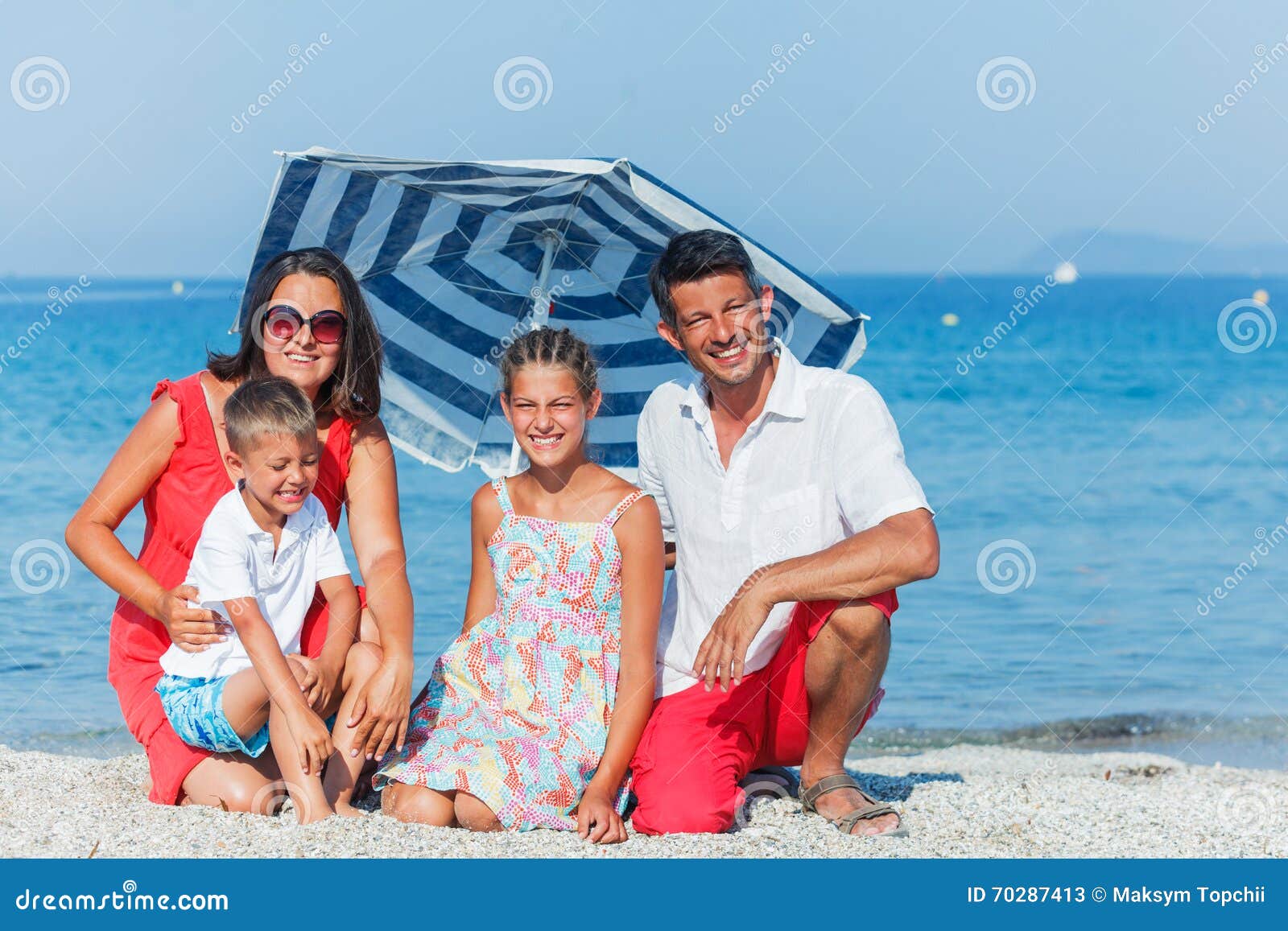 Family on a sandy beach stock image. Image of sandy, posing - 70287413