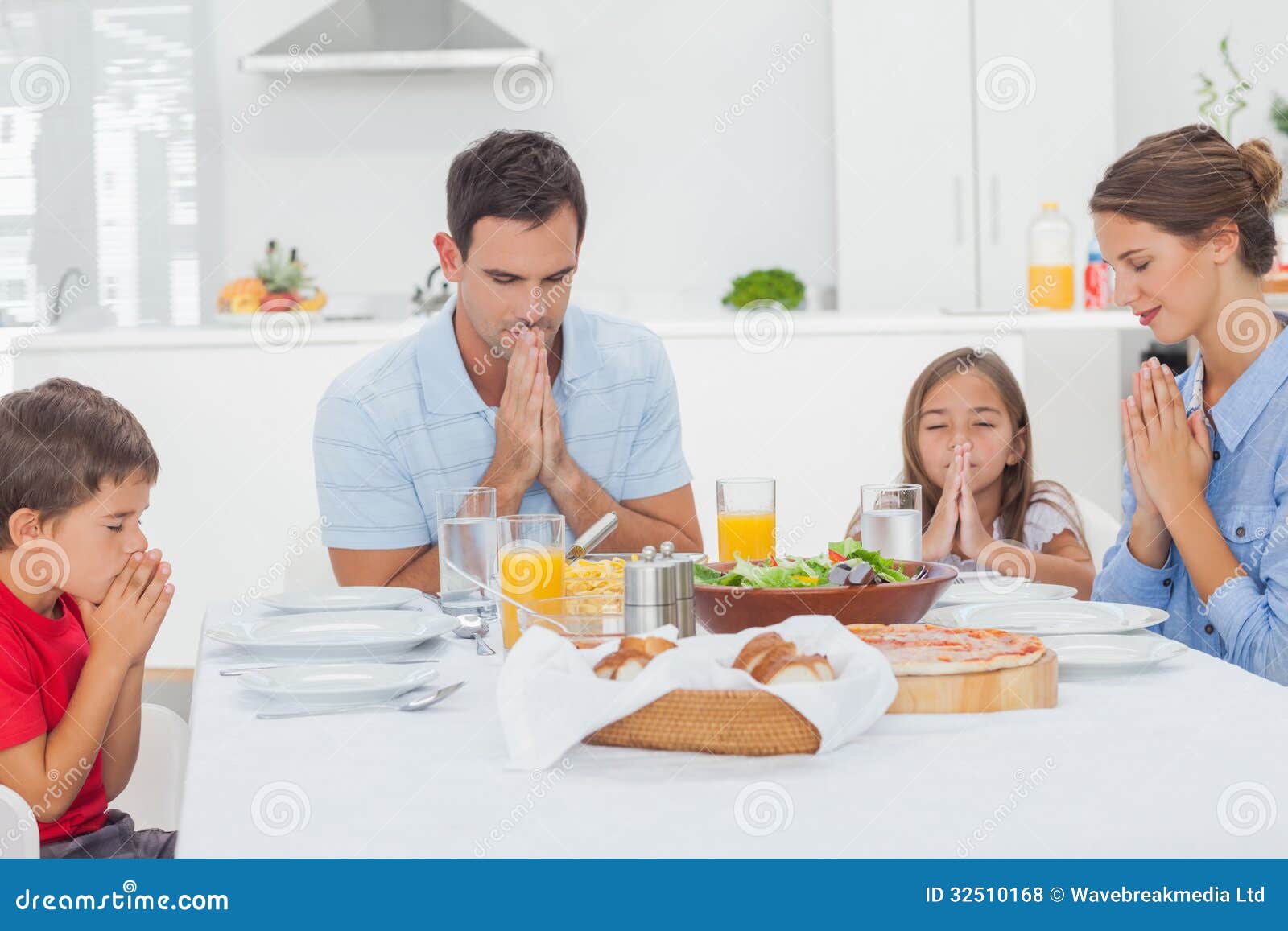 Family Saying Grace before Dinner Stock Photo - Image of handsome, girl ...