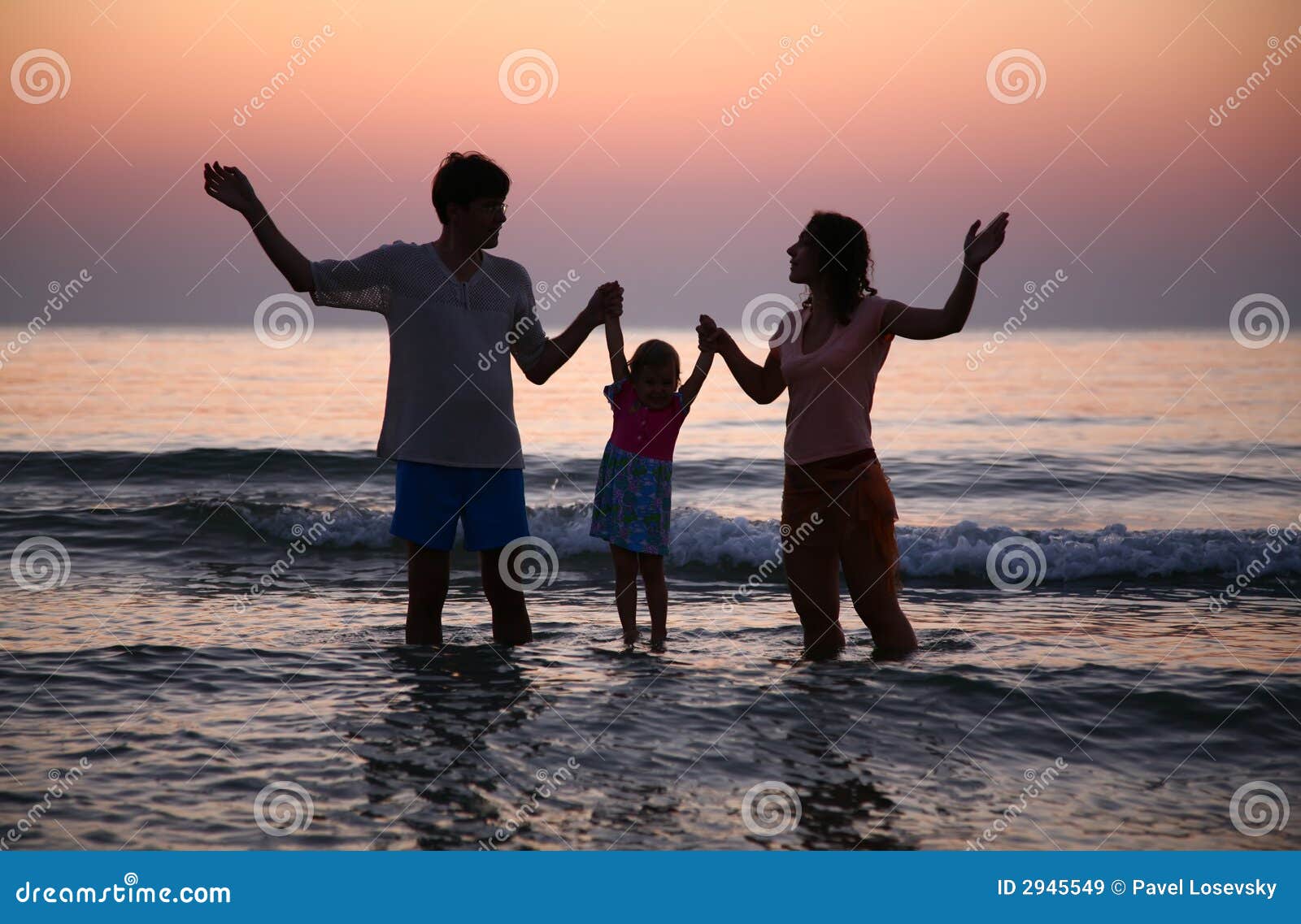 Family in Sea Against Sunset Stock Image - Image of hold, silhouette ...