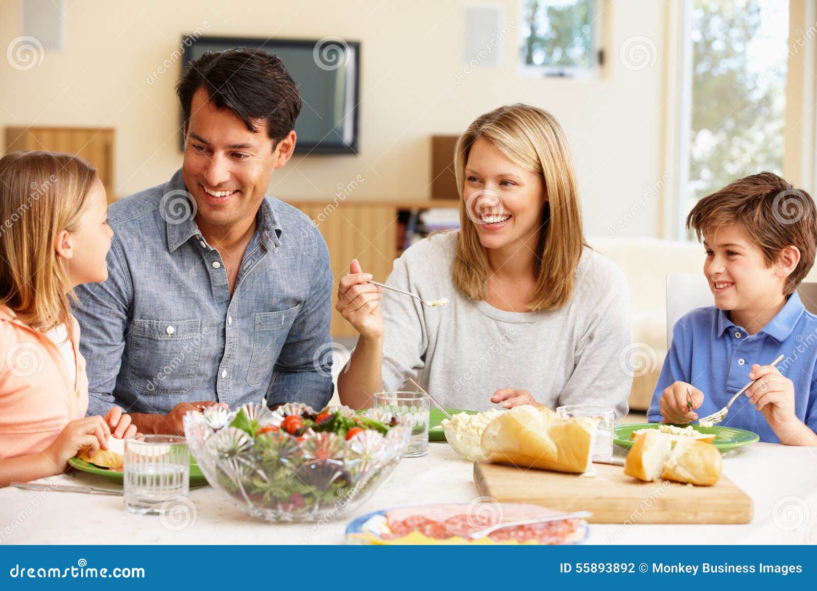 Family sharing meal stock photo. Image of indoors, lifestyle - 55893892