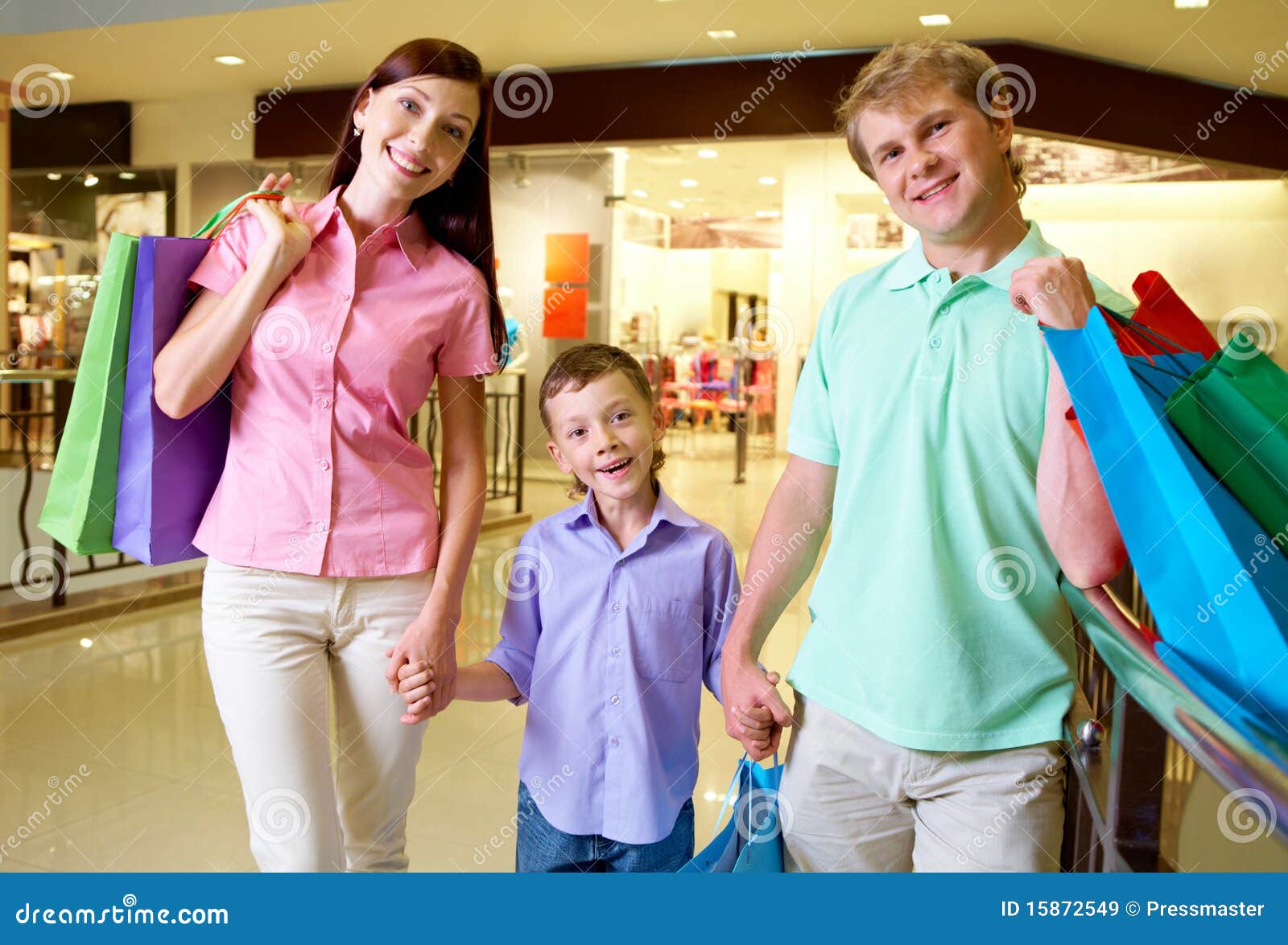 Family of shoppers stock image. Image of positive, parents - 15872549