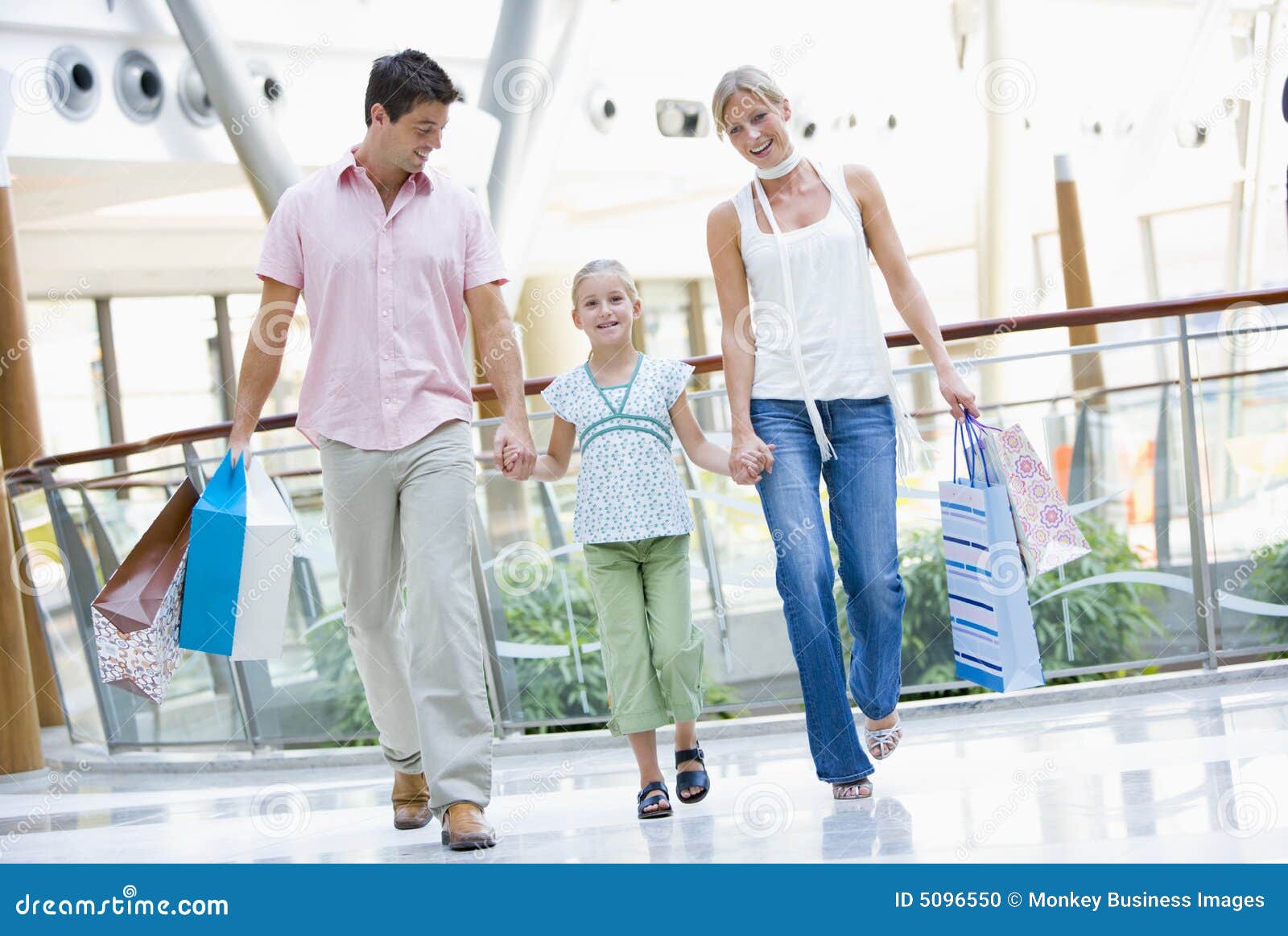 Family shopping in mall stock photo. Image of shopper - 5096550