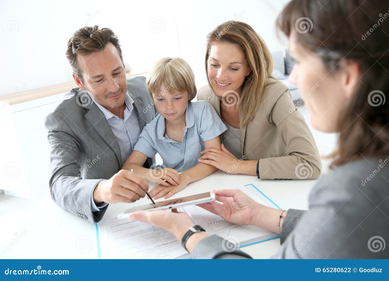 Family Signing a Contract on Tablet Stock Photo - Image of desk, expert ...